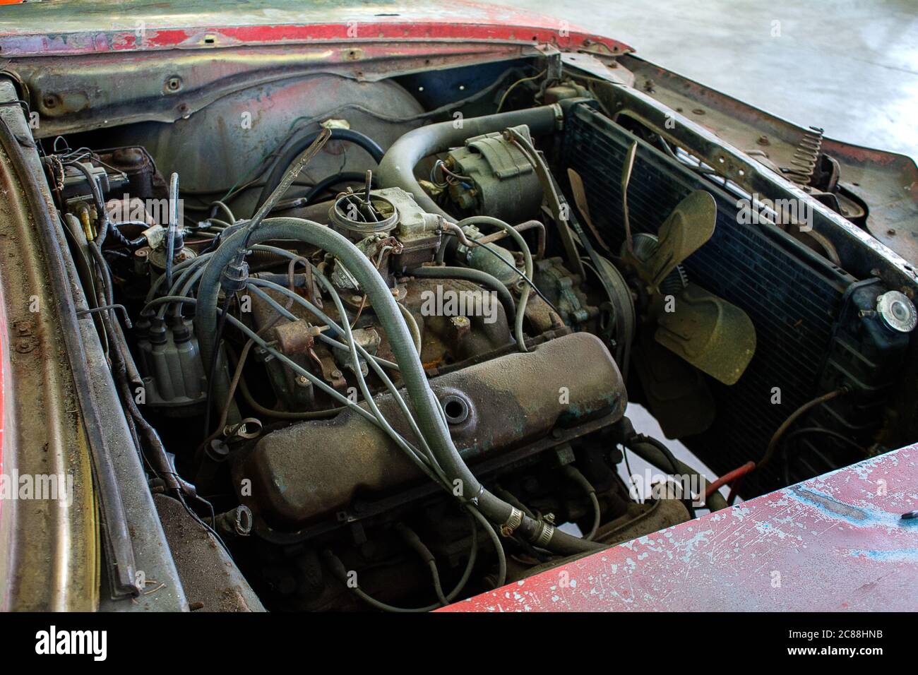 an old V8 engine still to be restored in a muscle car Stock Photo - Alamy