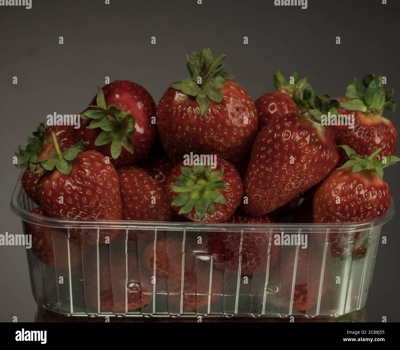 red ripe strawberry in plastic box of packaging Stock Photo - Alamy
