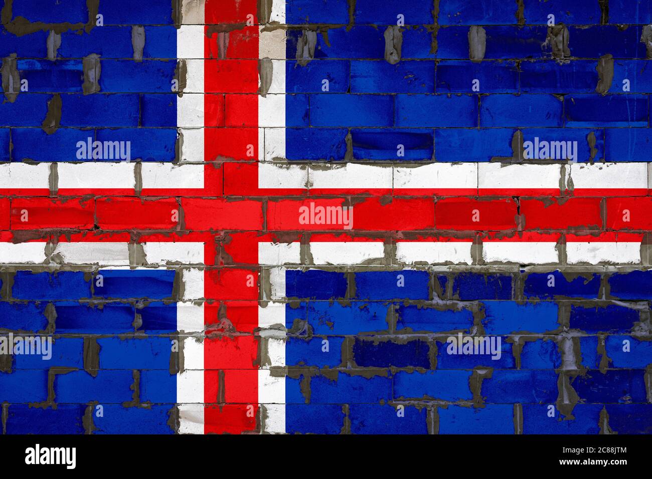 The national flag of Iceland painted on a wall of sibit blocks with ...