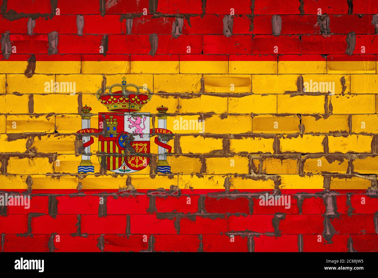 The national flag of Spain painted on a wall of sibit blocks with ...