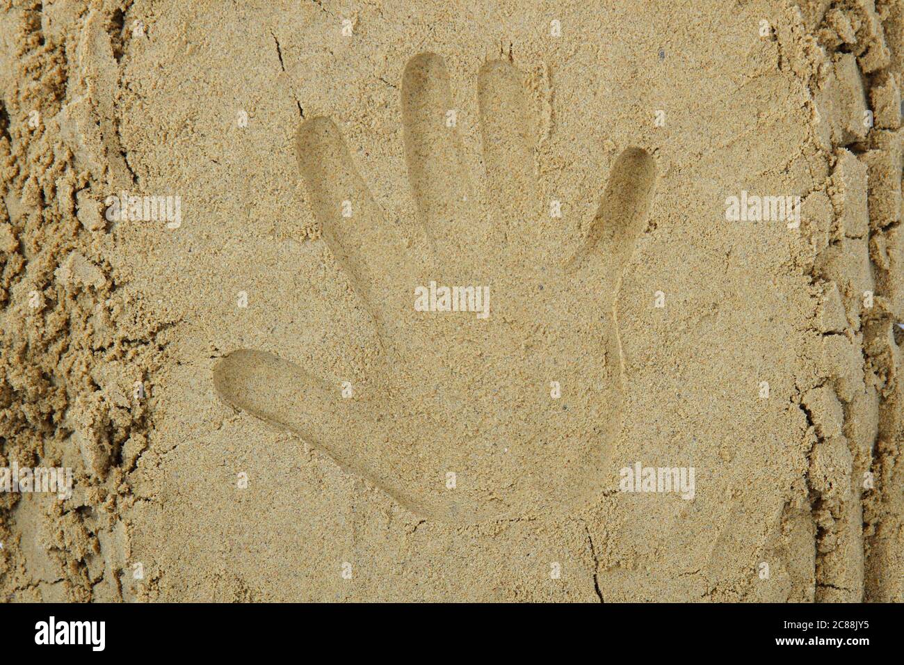 hand print in the sand as nice summer background Stock Photo - Alamy