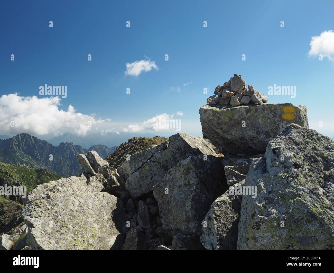 mountain trek scenery cairn yellow marked path, stone pile Stock Photo ...