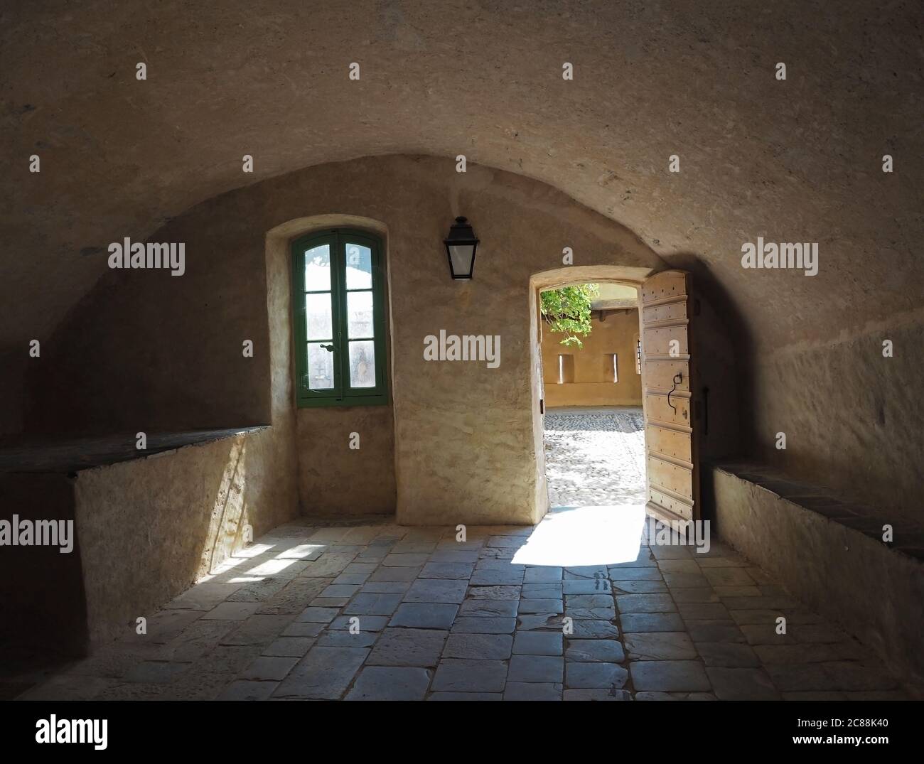 medieval house with barrel vault open door lantern green window and ...