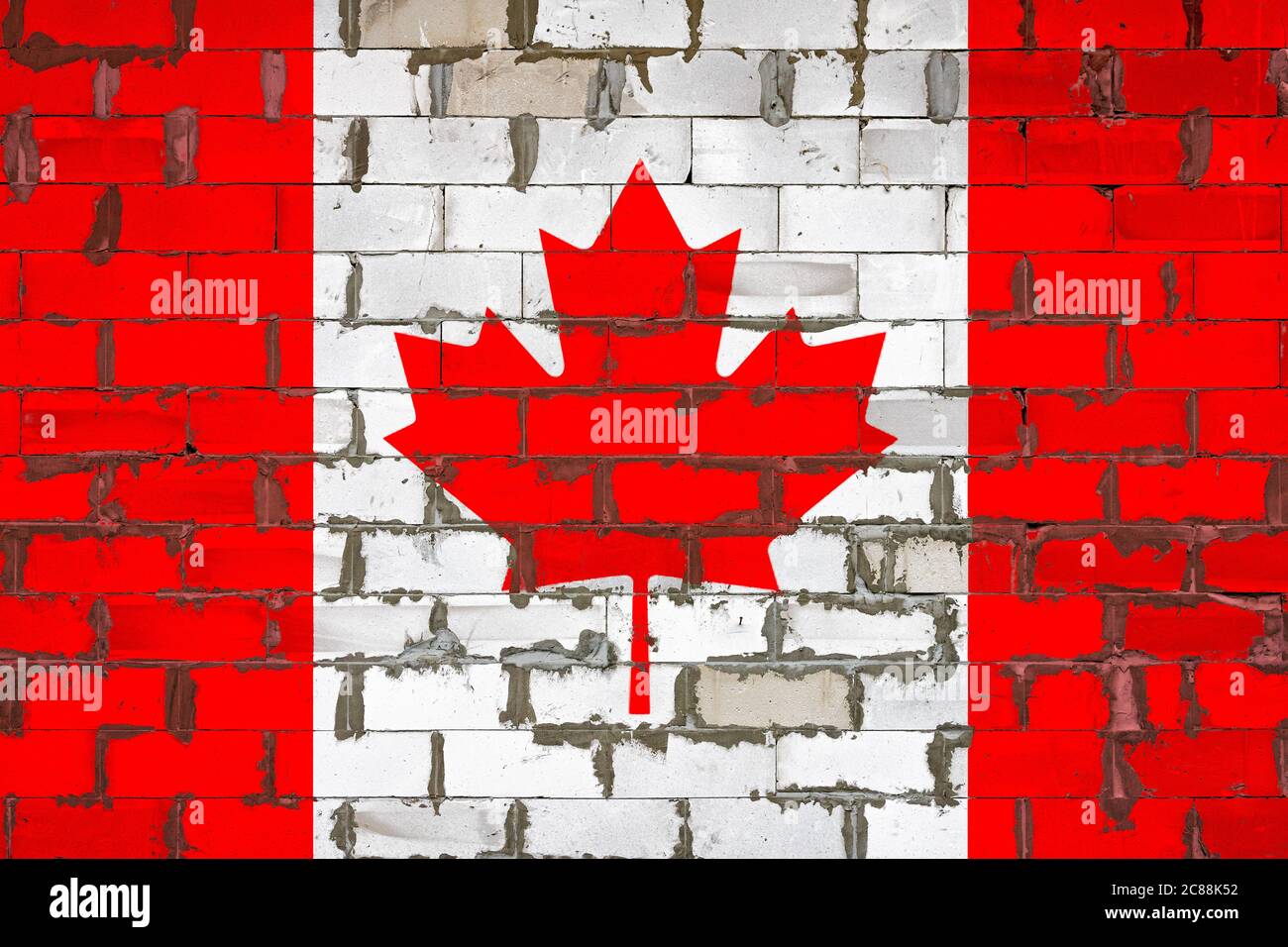 The national flag of Canada painted on a wall of sibit blocks with ...