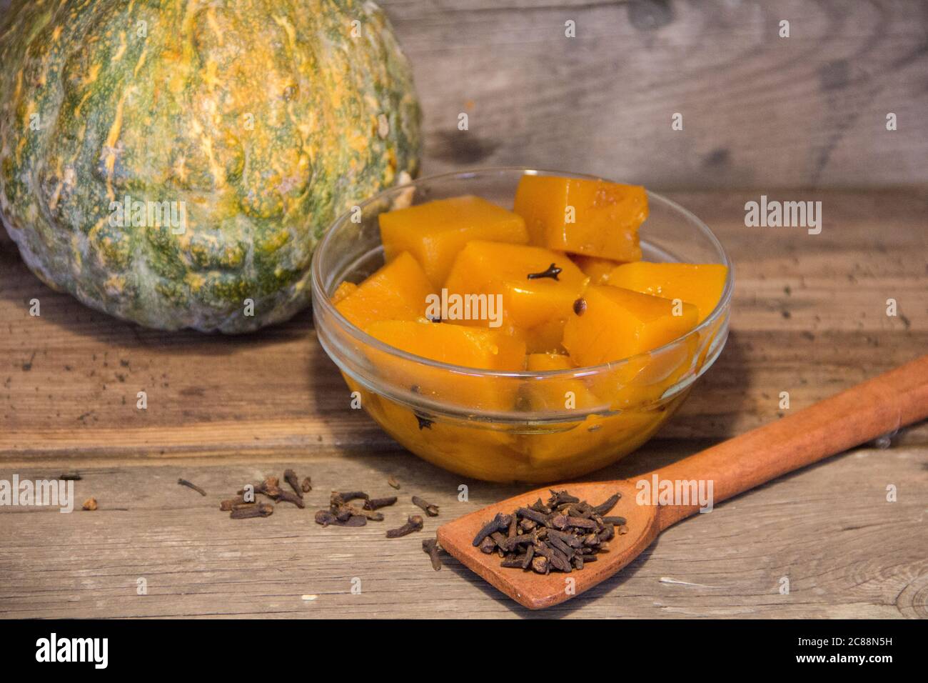cubed squash candy with syrup and cloves Stock Photo - Alamy