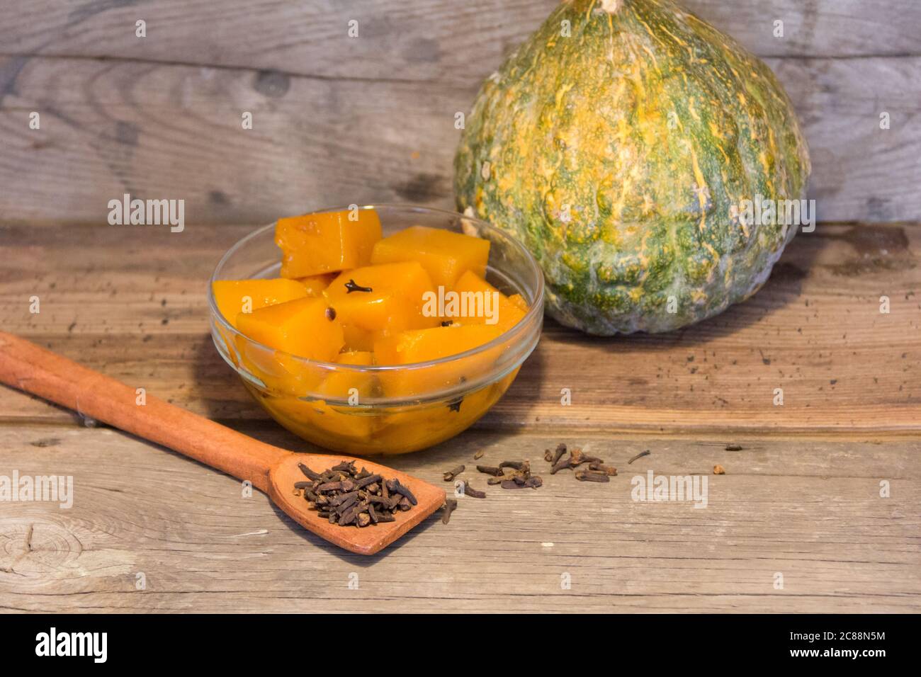 cubed squash candy with syrup and cloves Stock Photo - Alamy