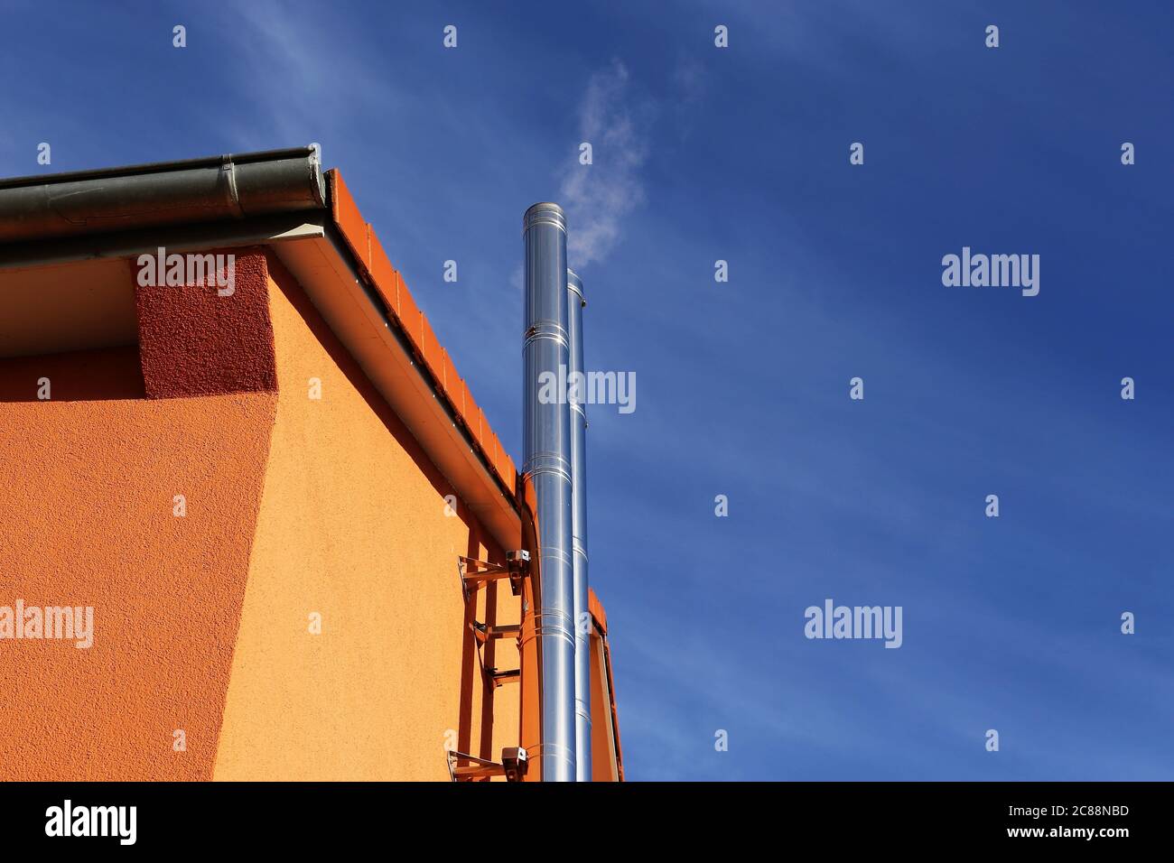 Stainless steel chimney on a new residential home Stock Photo - Alamy