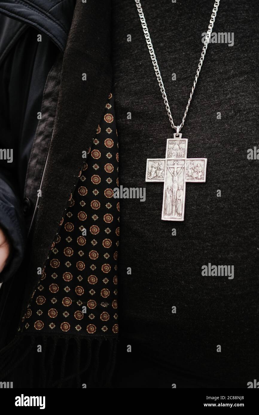 Man wearing a cross hi-res stock photography and images - Alamy
