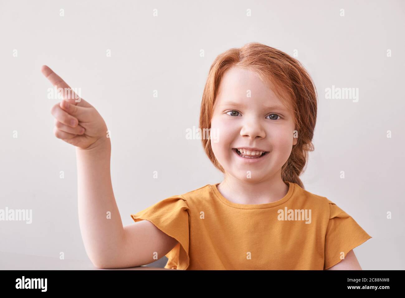 Pretty young student pointing. Elementary school children Stock Photo ...