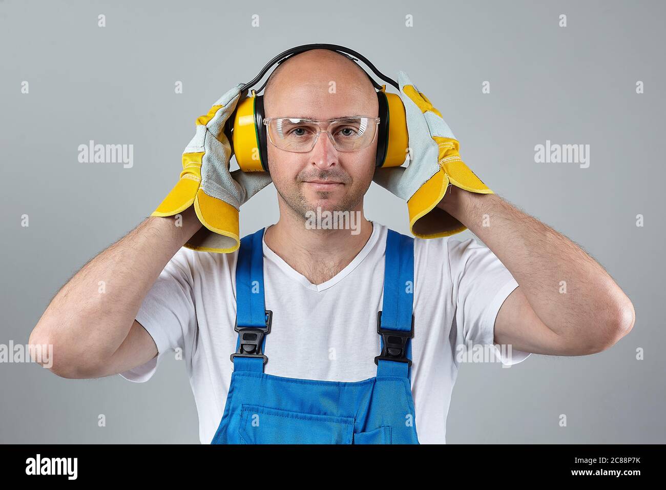 adult male in a construction uniform. photo session in the Studio on a ...