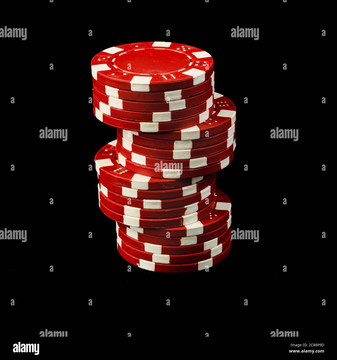 Red poker chips isolated on black background Stock Photo - Alamy