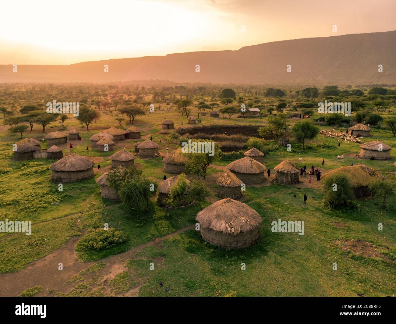 Aerial Drone Shot. Traditional Masai village at Sunset time near Arusha ...