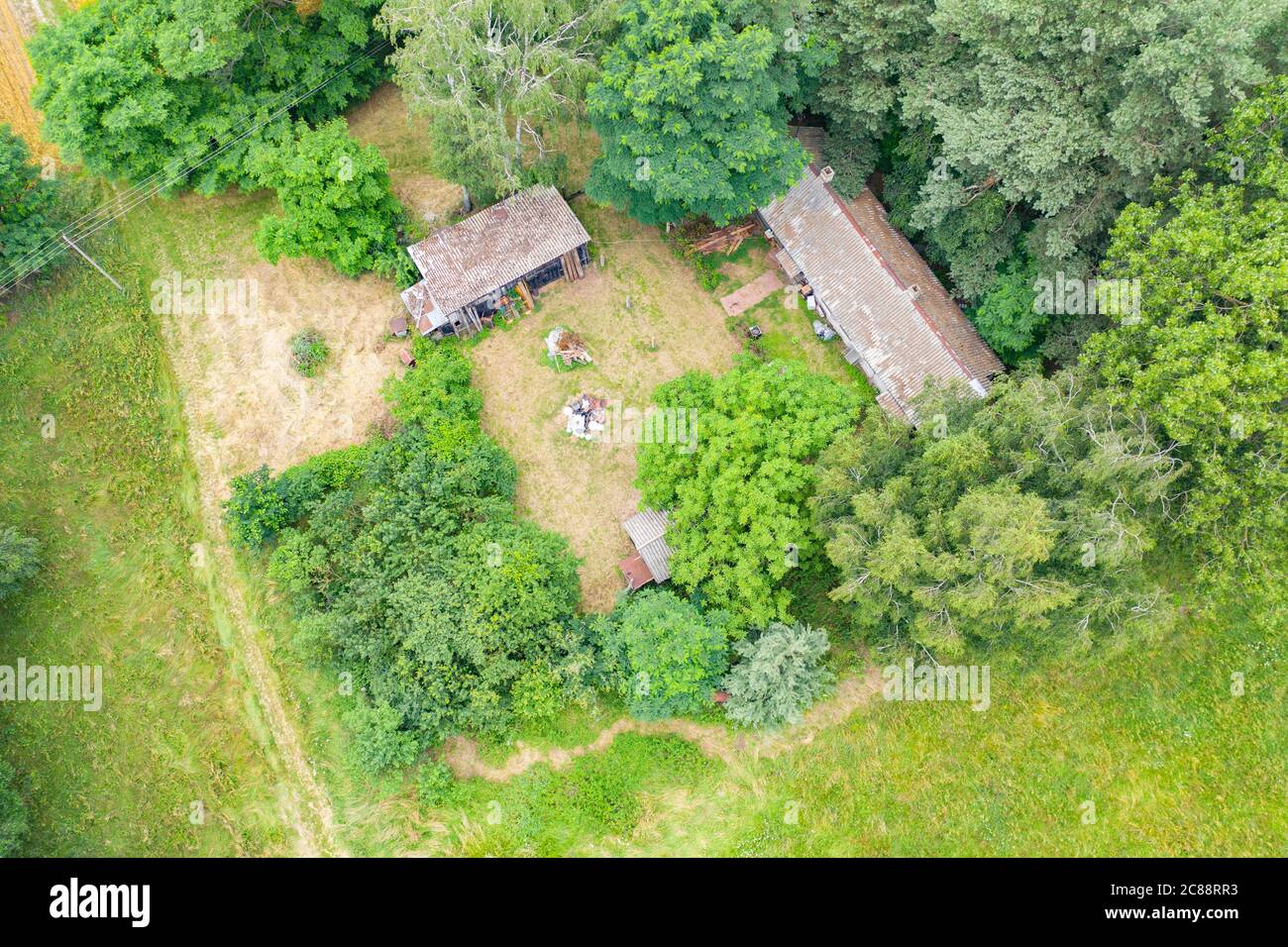 Aerial view of secluded cottage in the woods. Log cabin in the forest ...