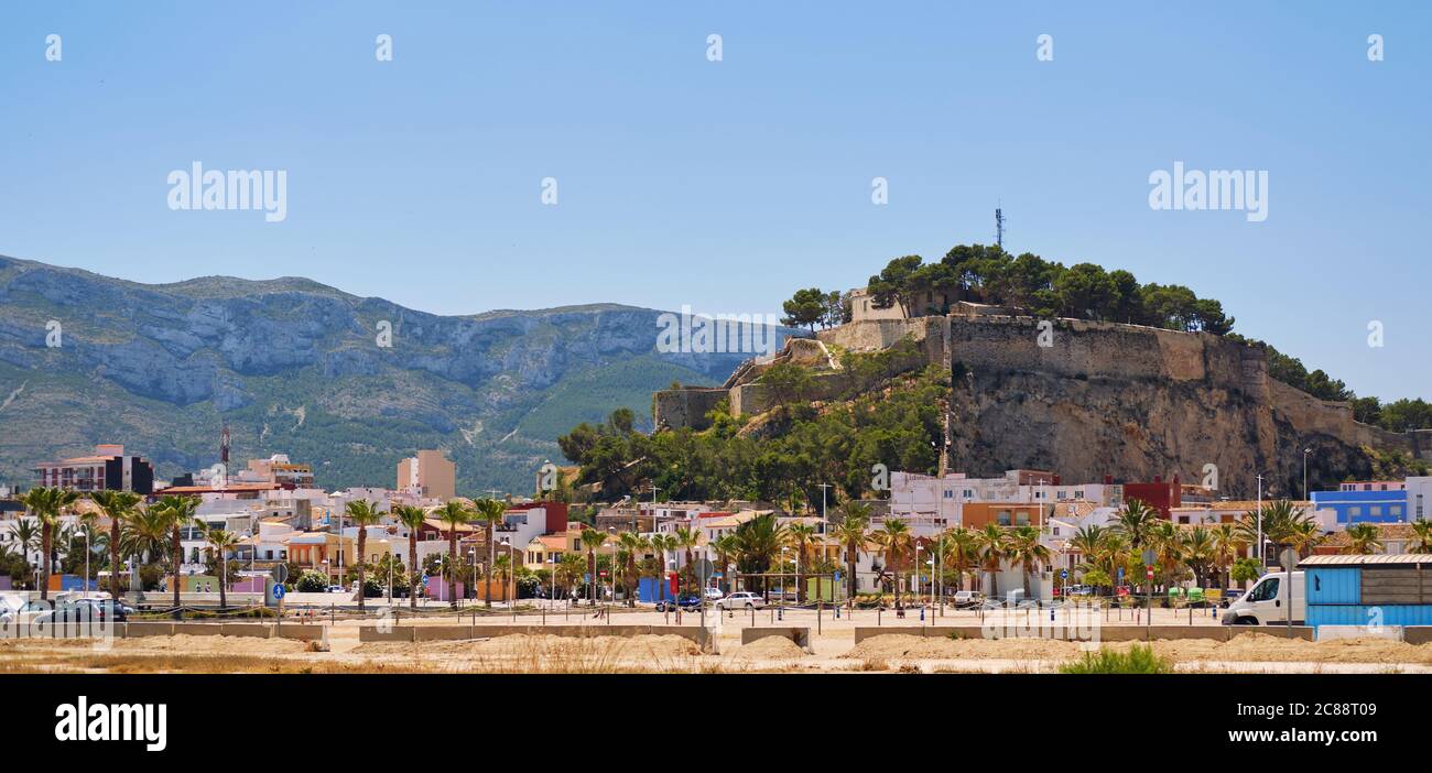 Panoramic photo on blue sky background ancient famous Denia Castle ...