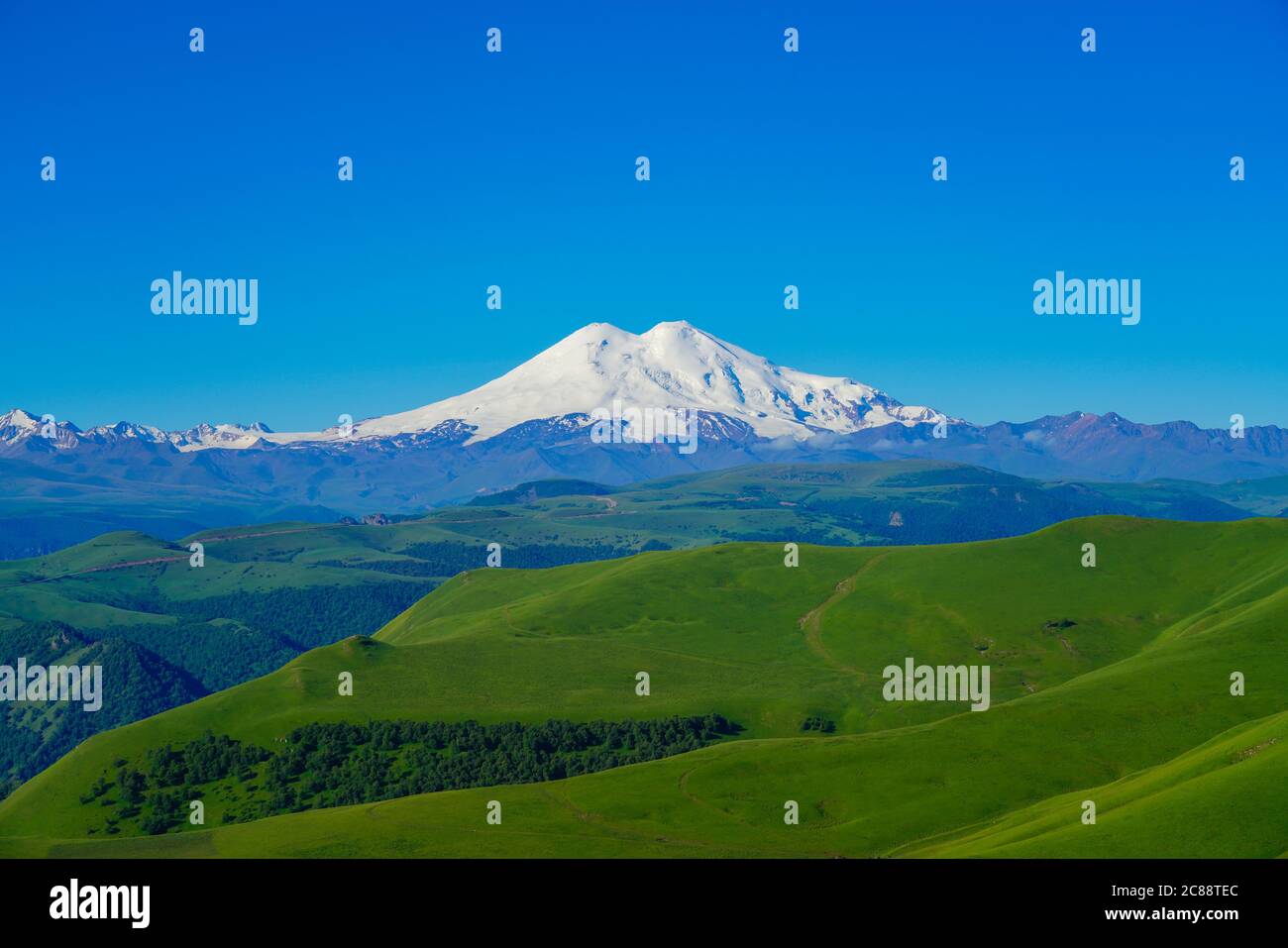 Amazing Background Elbrus and Green Meadow Hills at a Summer Day. North ...