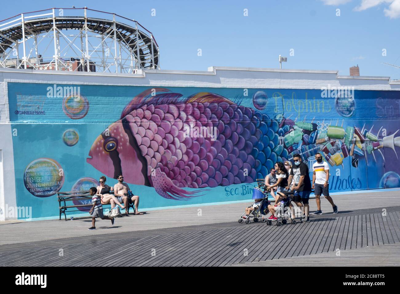Boardwalk at Coney Island. with environmental fish mural in the ...