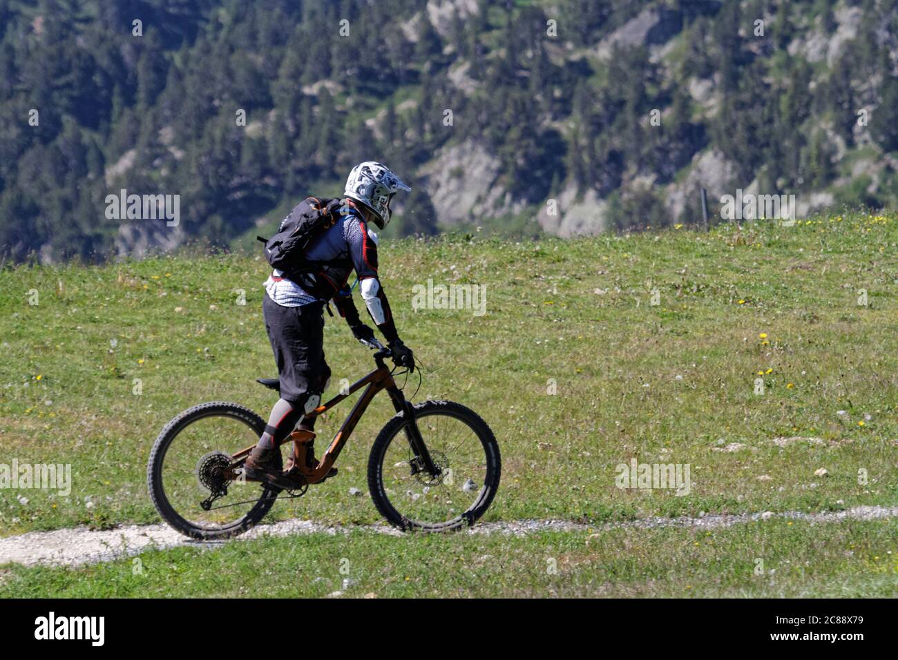 CHAMROUSSE, FRANCE, July 8, 2020 : Biker on mountain paths. Chamrousse ...