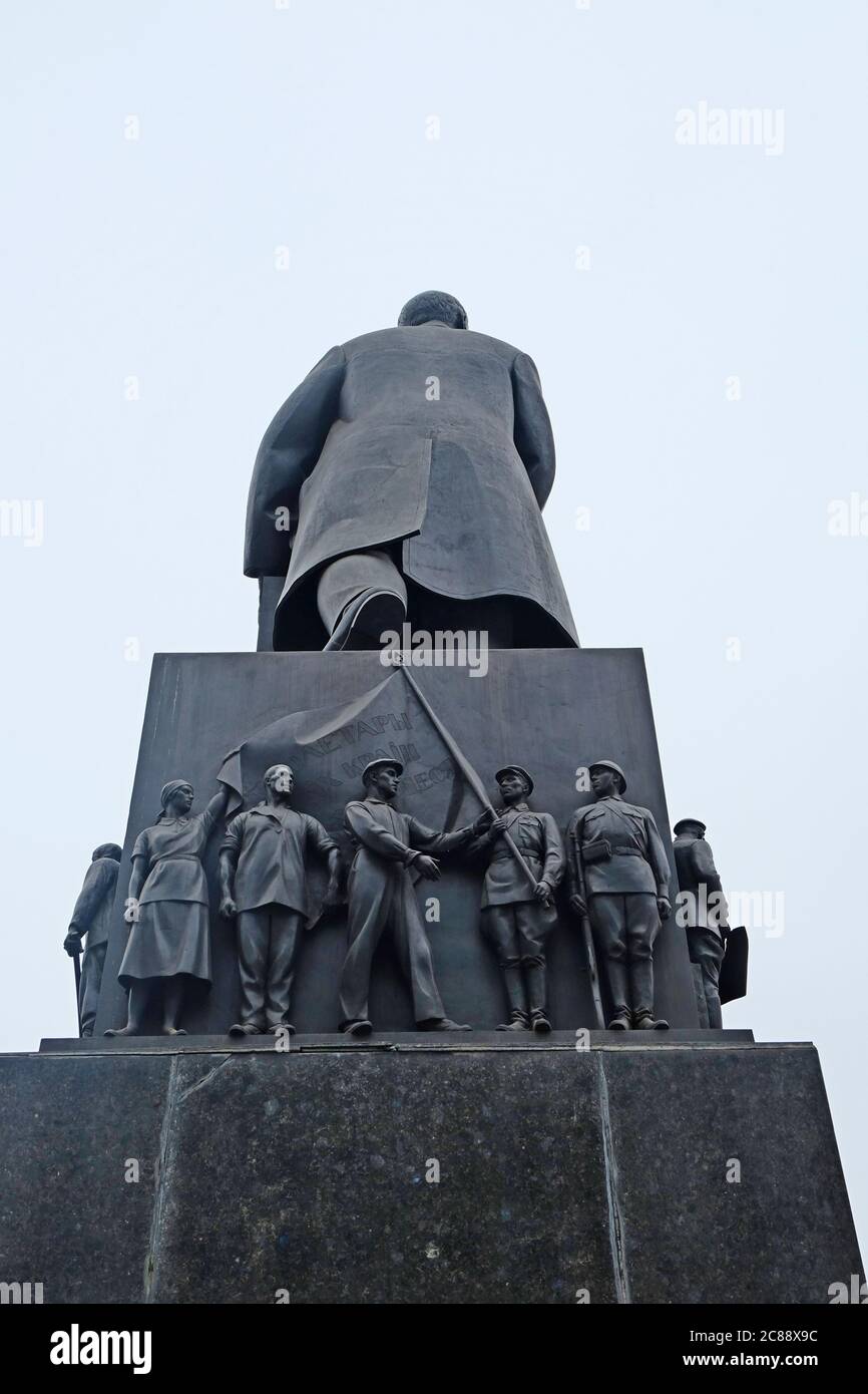 Rear view of Lenin's statue on plinth in front of the Belarussin House ...
