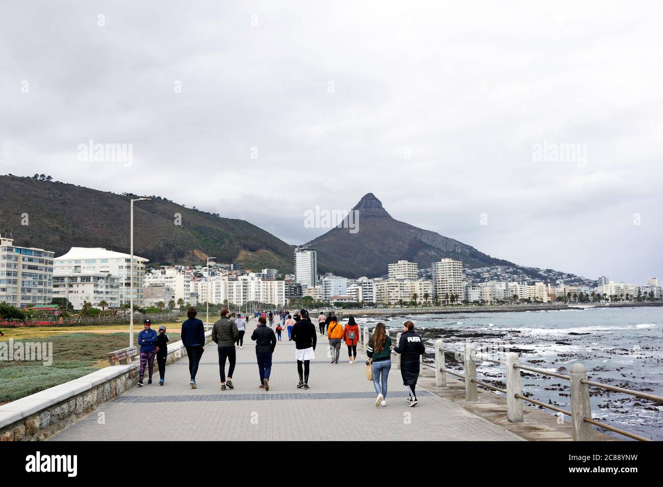 People walking along the Seapoint promenade, Cape Town, South Africa ...