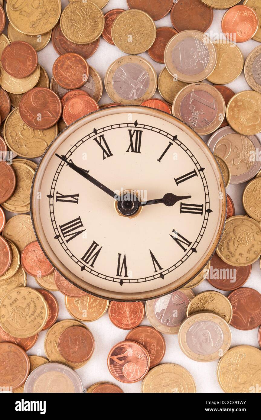 Picture of a Business Money Concept Idea, Clock and Coins Stock Photo ...