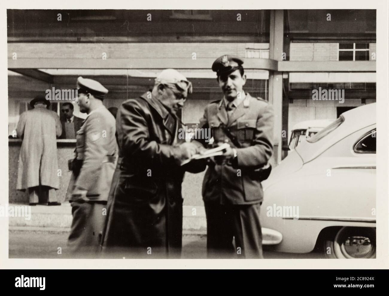 Italian customs official checking papers at the border crossing from ...