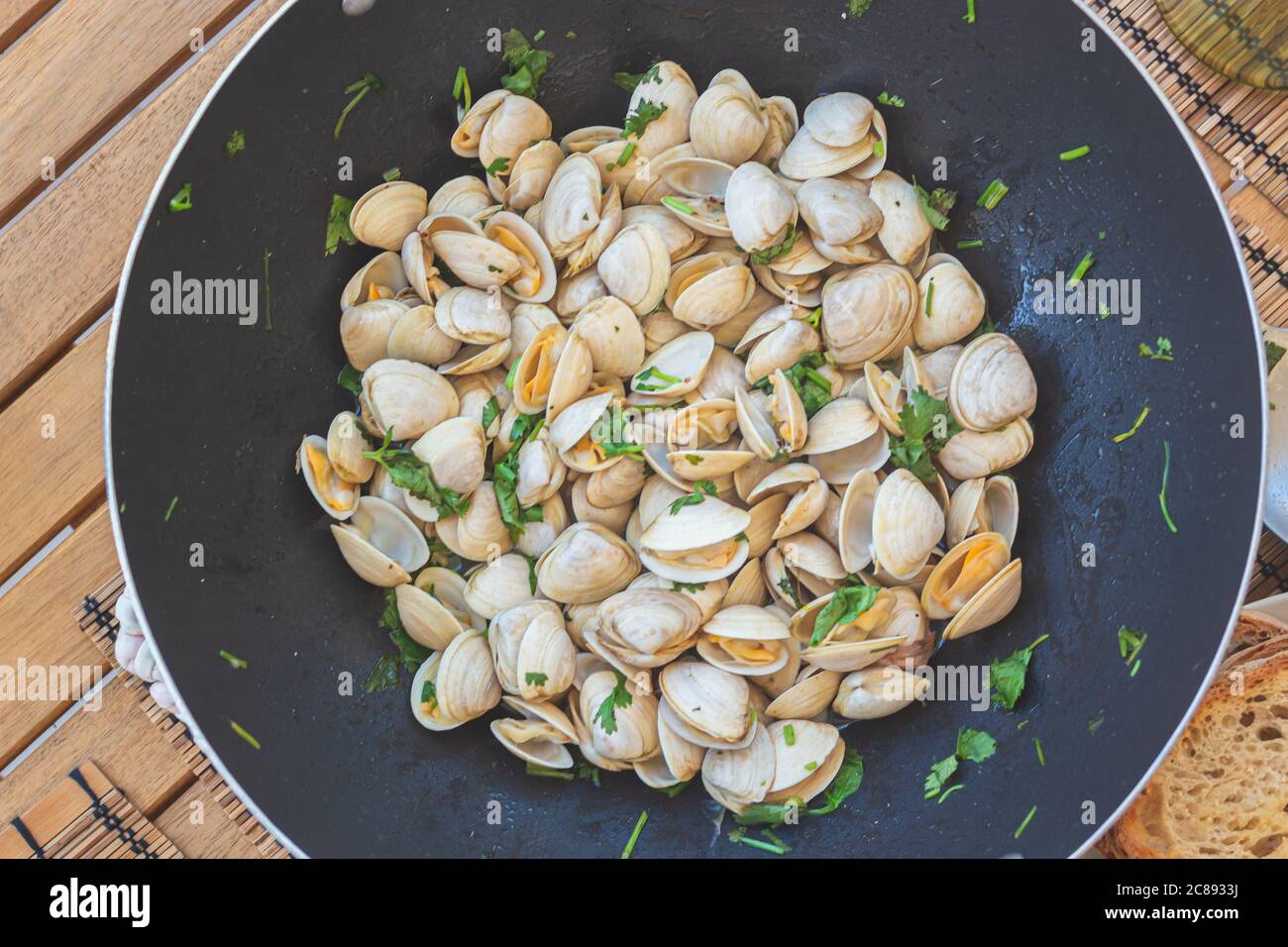 Clams cooked in a pan, healthy lunch Stock Photo - Alamy
