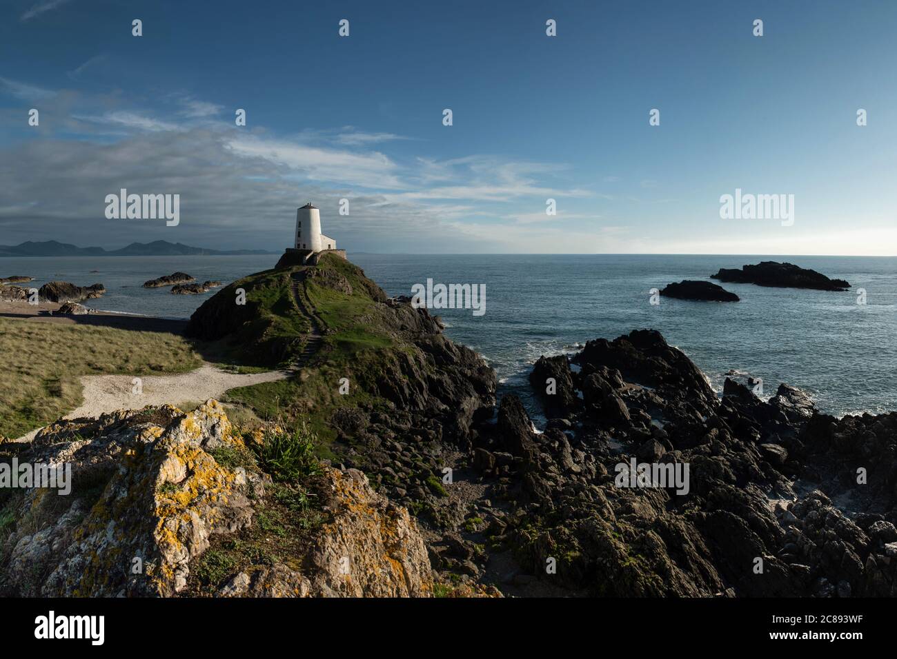 North Wales coast, evening landscape with the Llanddwyn Lighthouse, UK ...