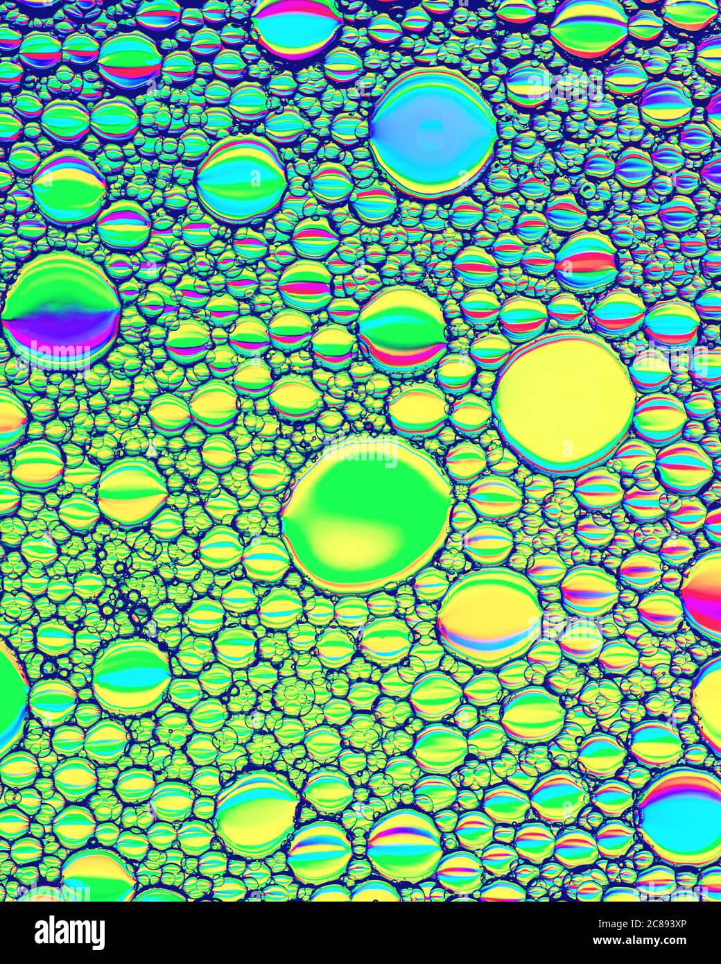 Colorful drops of oil on the water. Circles and ovals. Abstract bright ...