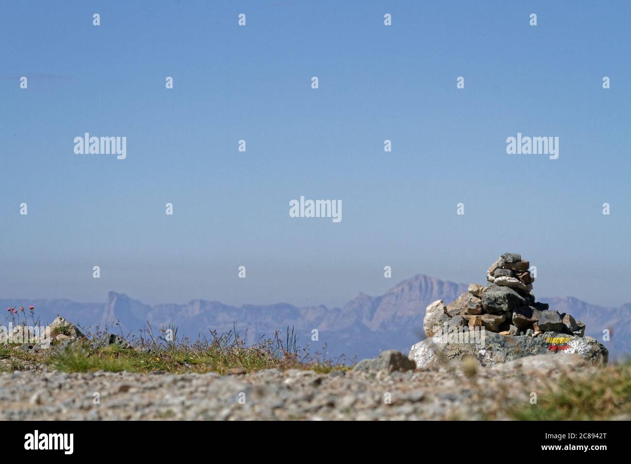 A cairn shows the direction on a mountain path Stock Photo - Alamy