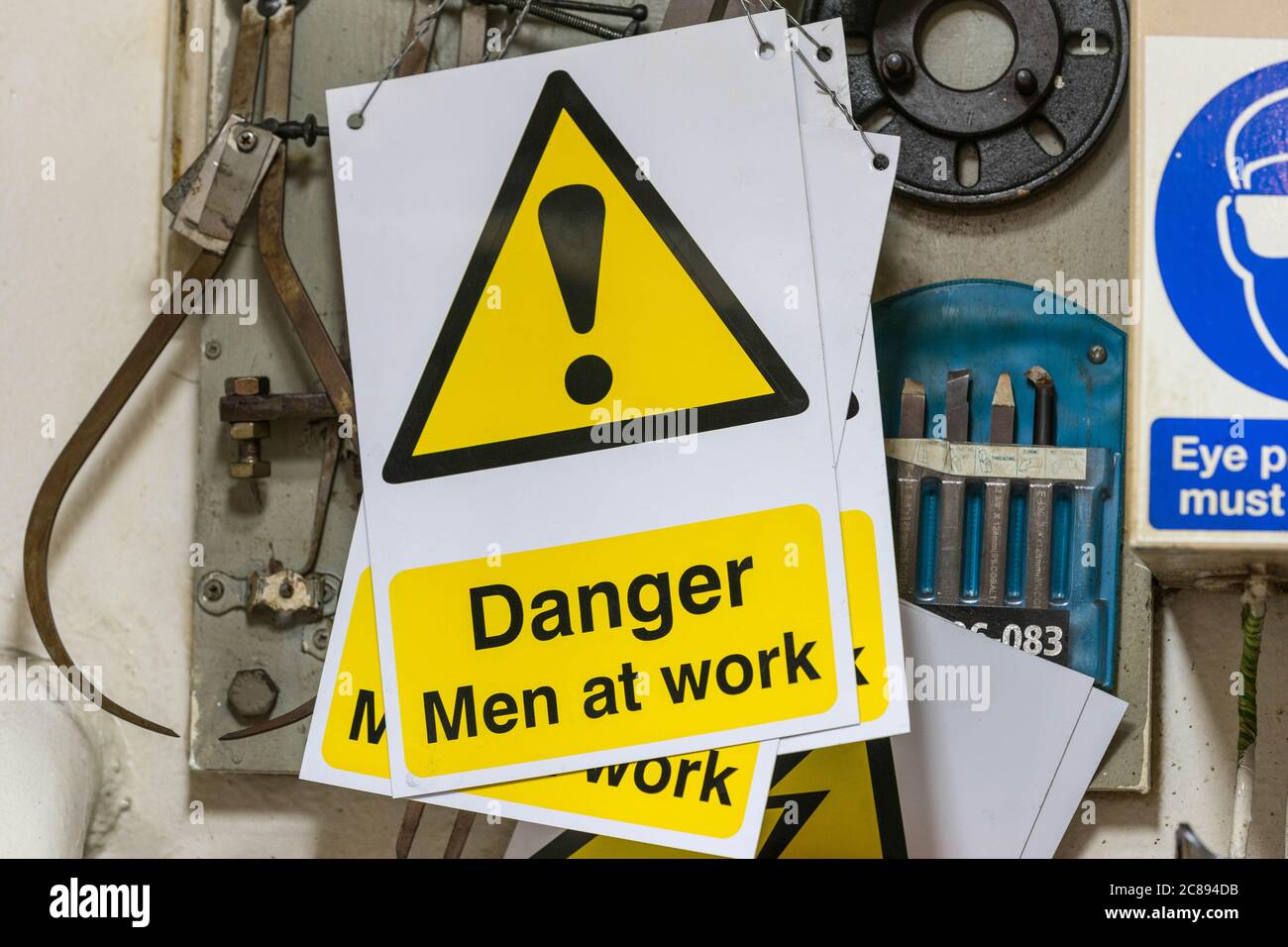 Danger Men at work sign Stock Photo - Alamy