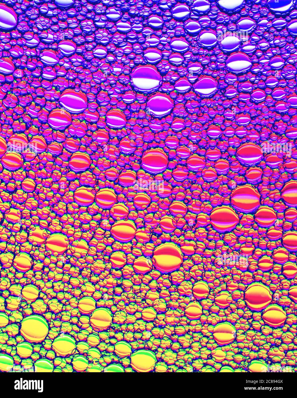 Colorful drops of oil on the water. Circles and ovals. Abstract bright ...