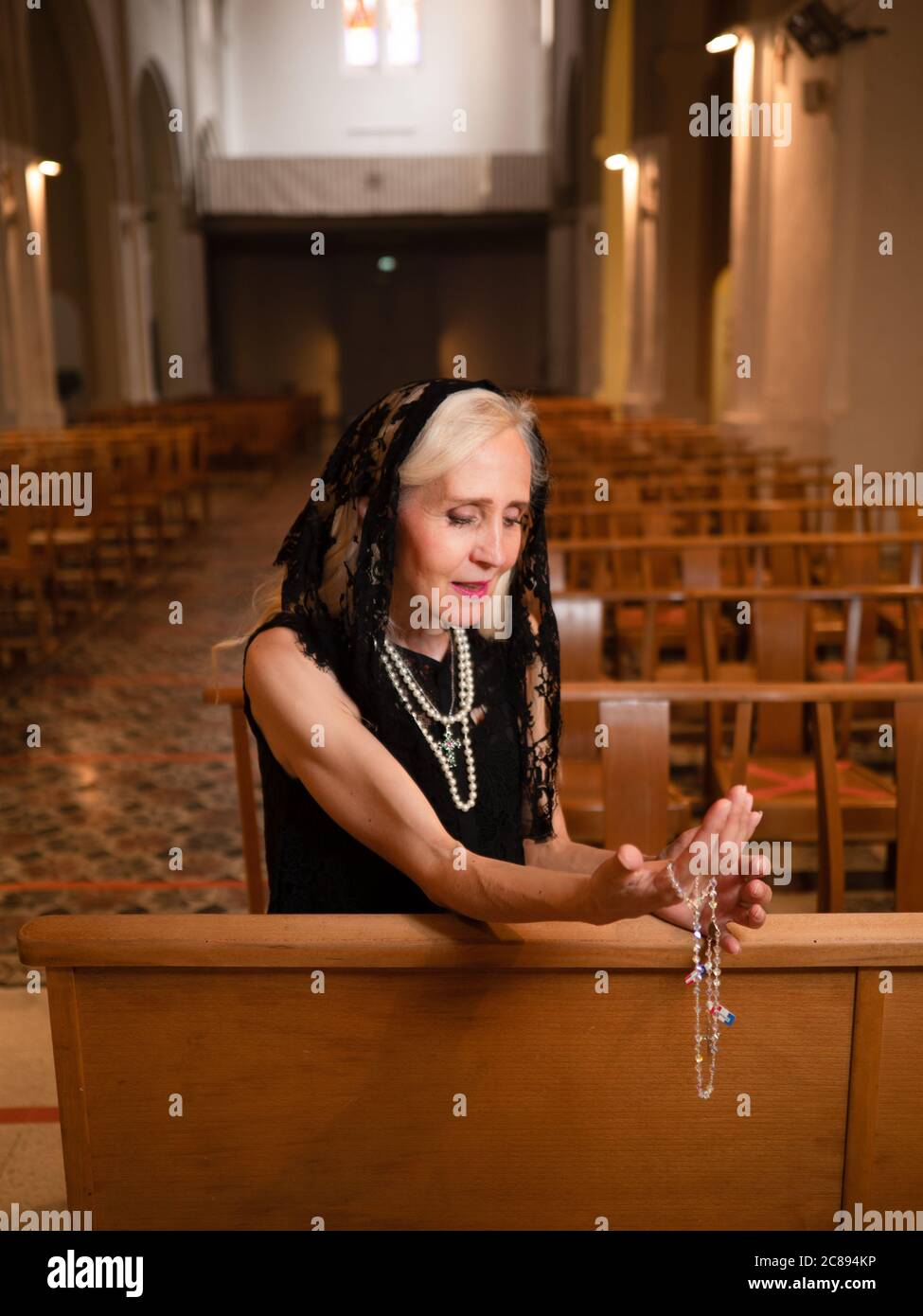 Pious looking woman hi-res stock photography and images - Alamy