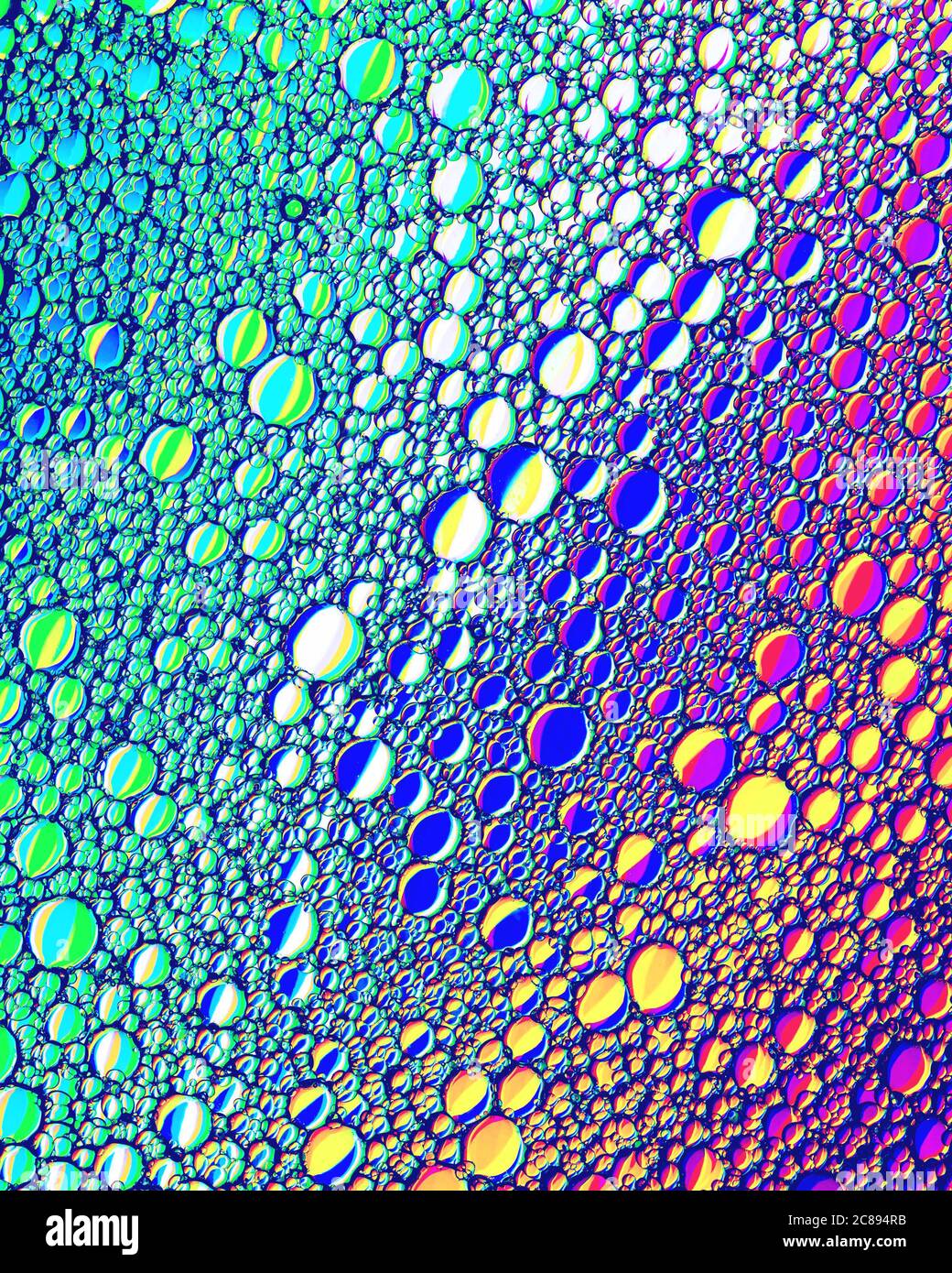 Colorful drops of oil on the water. Circles and ovals. Abstract bright ...