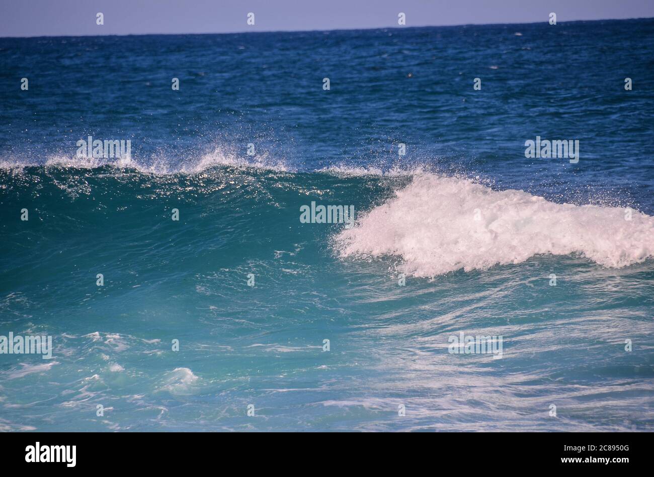Big Blue Wave Breaks in the Atlantic Ocean Stock Photo - Alamy