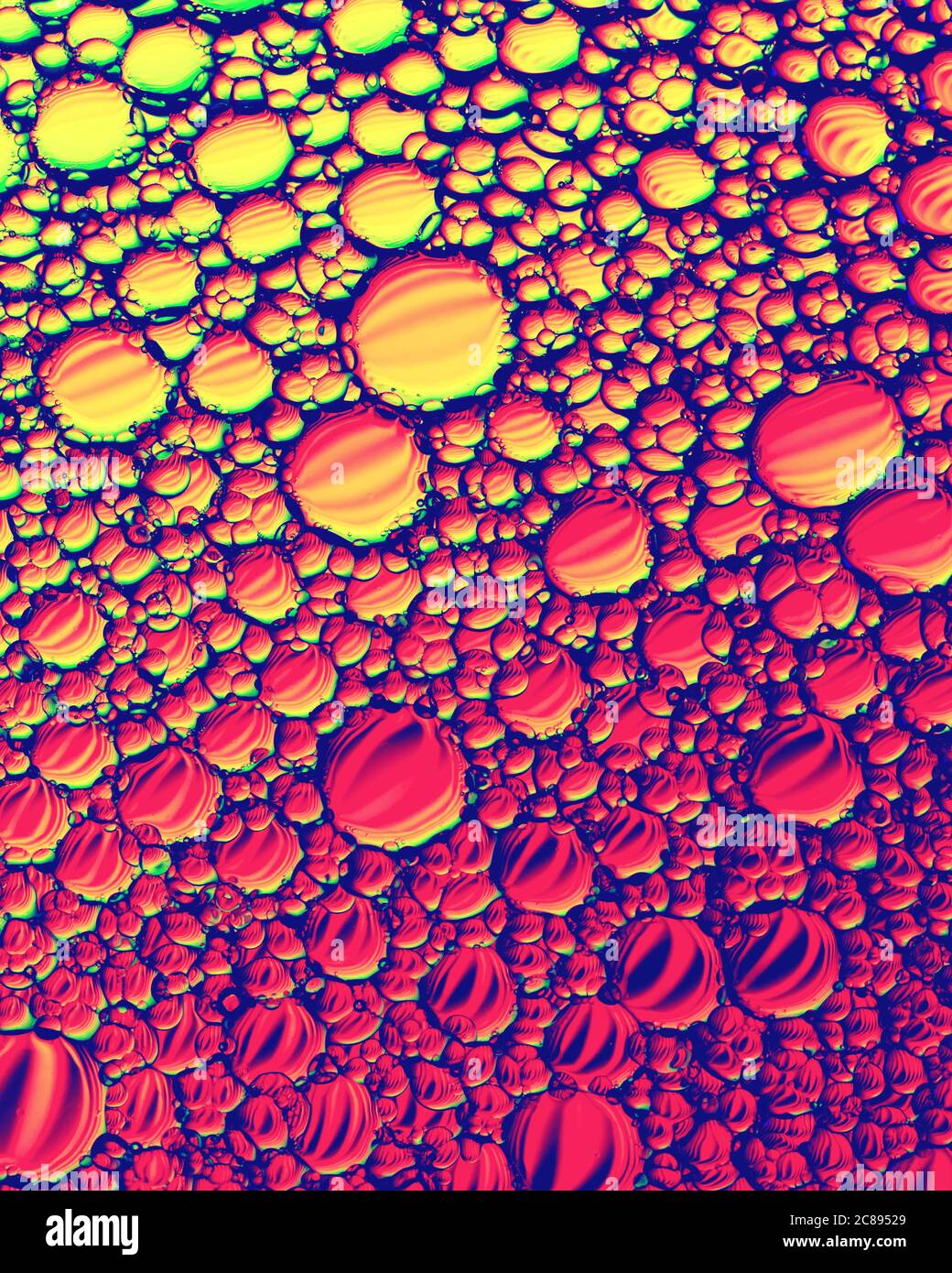 Colorful drops of oil on the water. Circles and ovals. Abstract bright ...