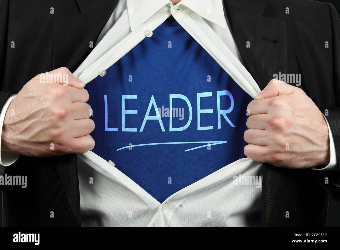 man opening his shirt to reveal his true identity Stock Photo - Alamy