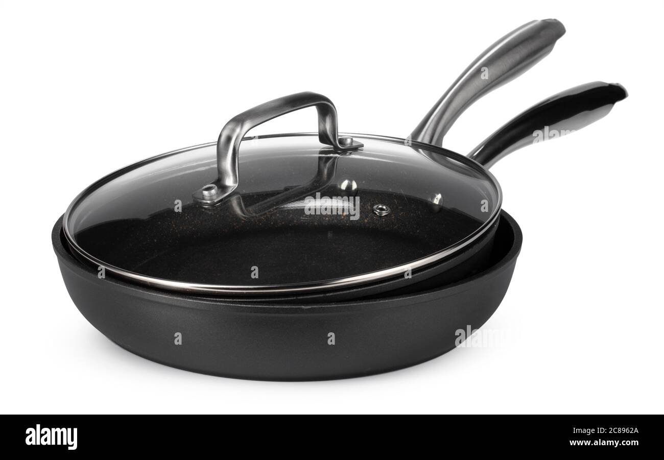Set of new black pans isolated on white Stock Photo - Alamy