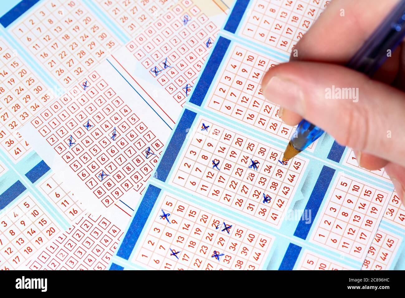 hand with pen picking numbers on lottery ticket Stock Photo - Alamy hand with pen picking numbers on lottery ticket Stock Photo - Alamy