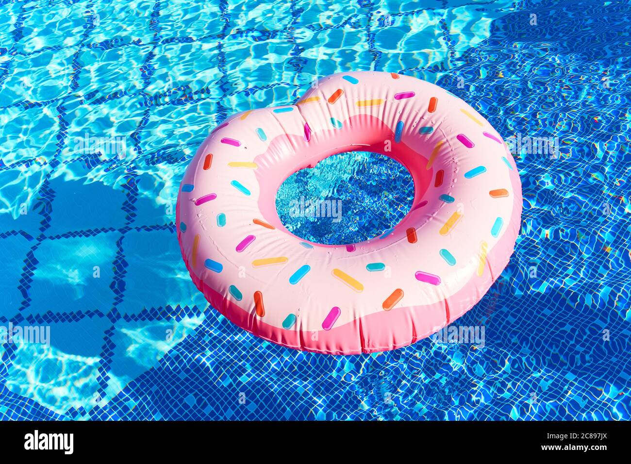 Pink pool float ring Stock Photo - Alamy