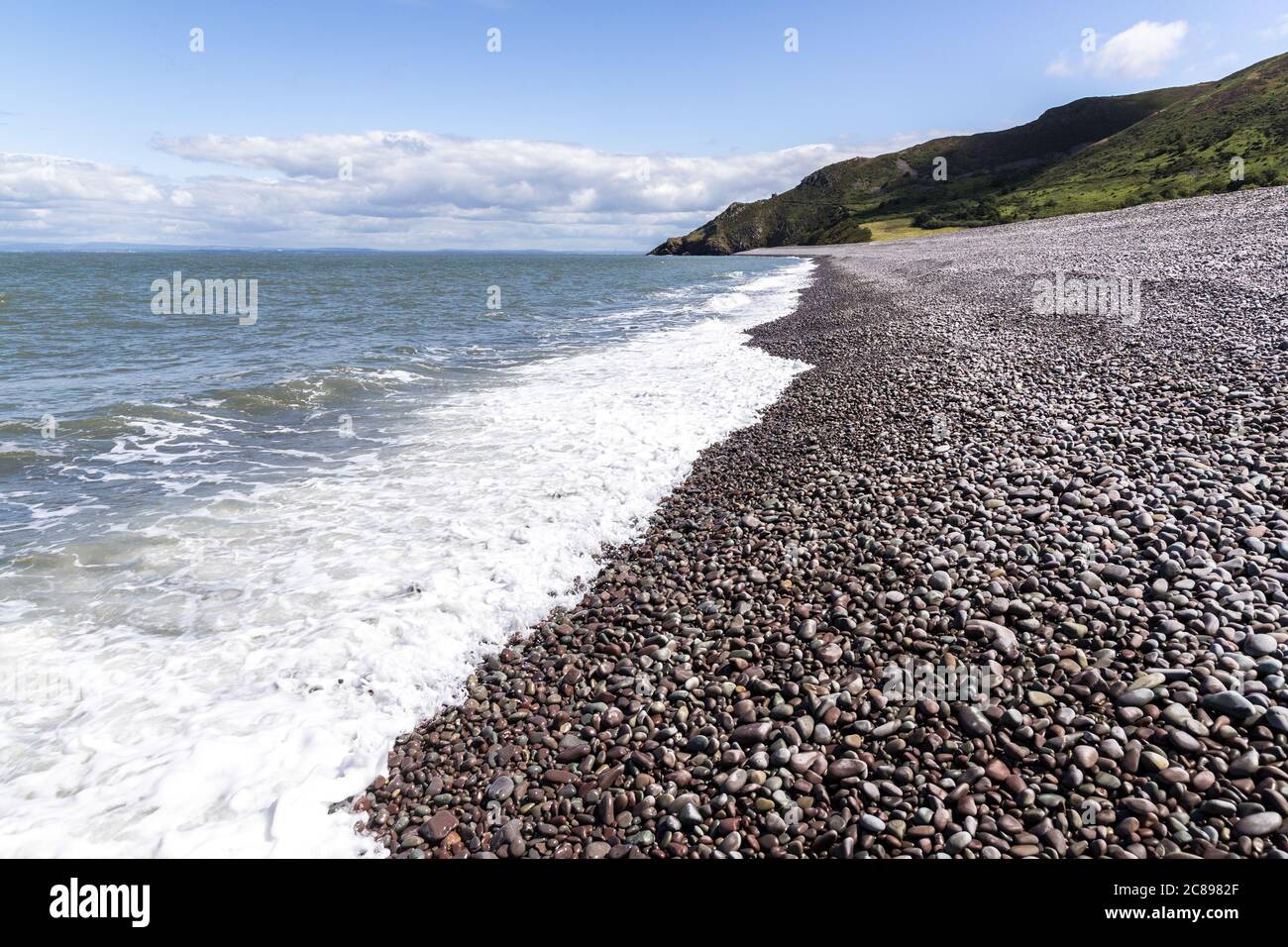 The shingle and pebble barrier ridge of Bossington Beach looking ...
