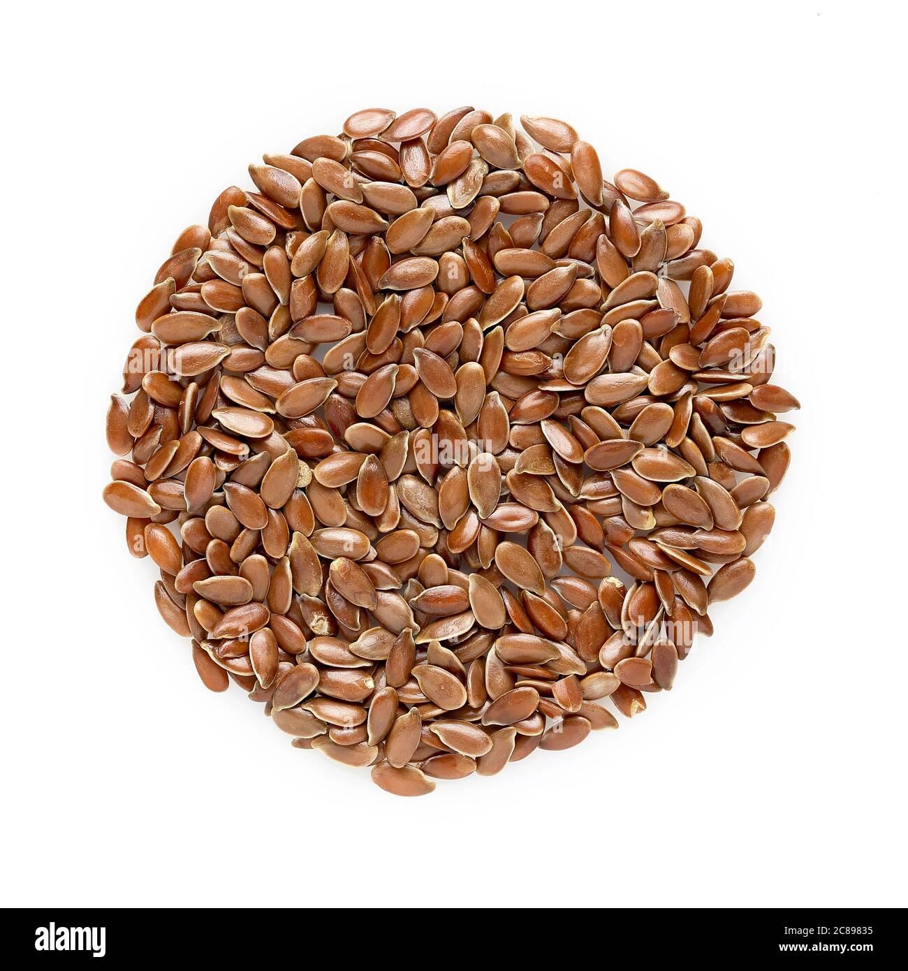 flax seeds or linseeds in circular shape isolated on white Stock Photo - Alamy