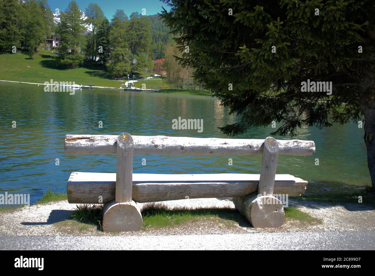Empty bench at the lake of Saint Moritz Stock Photo - Alamy