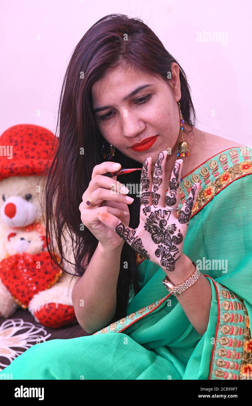 Beawar, Rajasthan, India, July 21, 2020: Young woman applying henna on ...