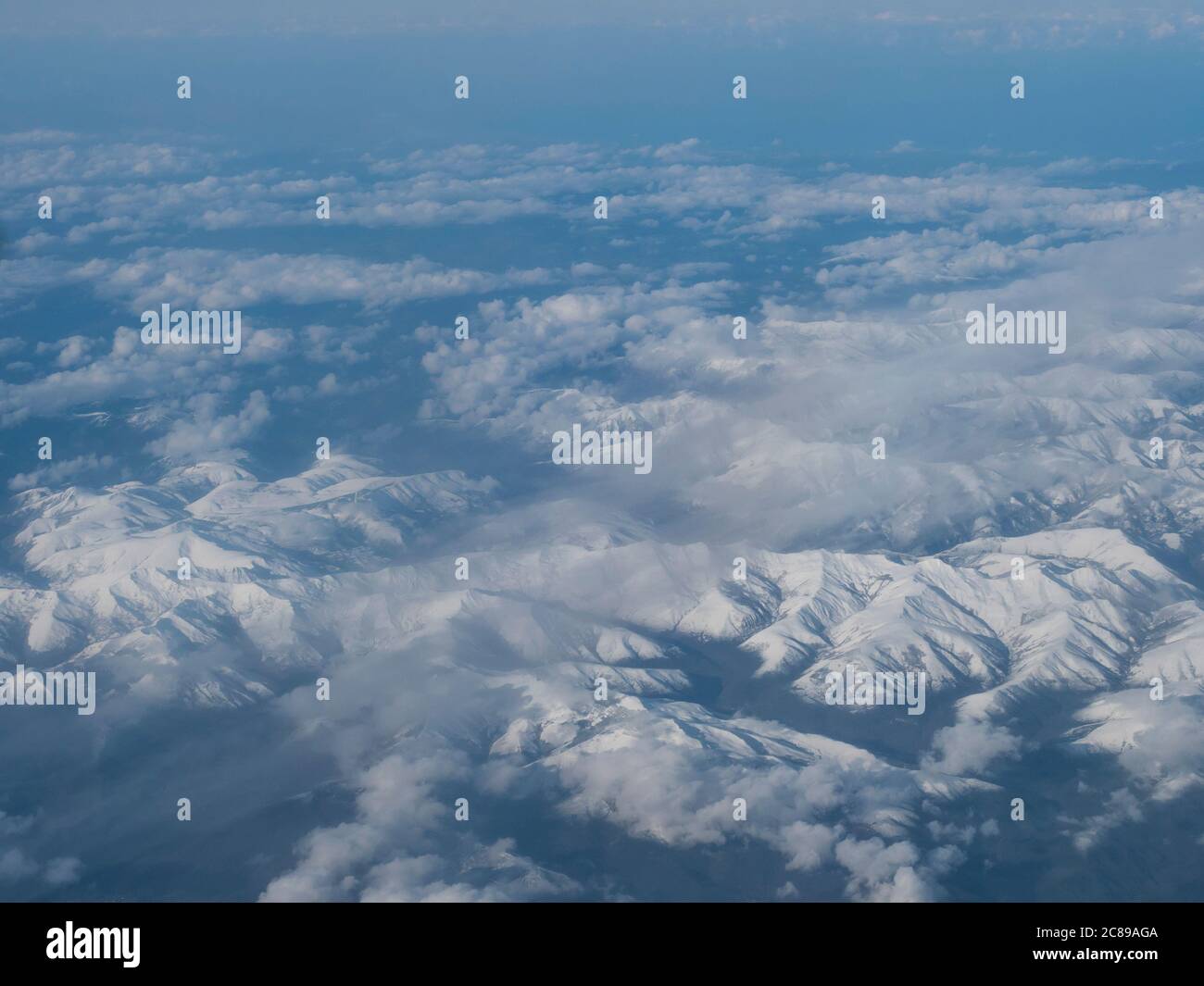 Aerial view of snow covered french and spanish pyrenees with snow ...