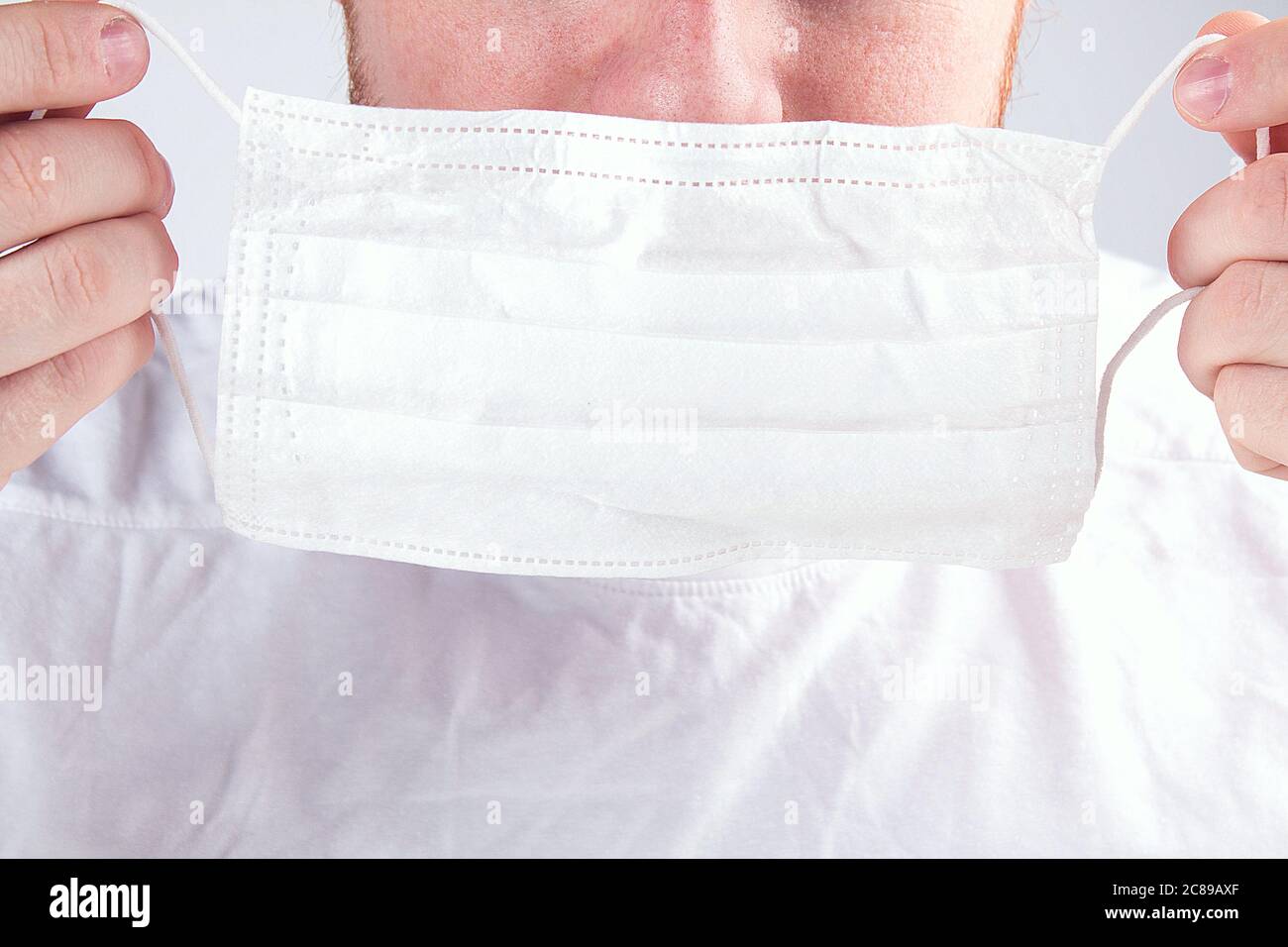 A man wearing a protective mask against coronavirus. Banner panorama ...
