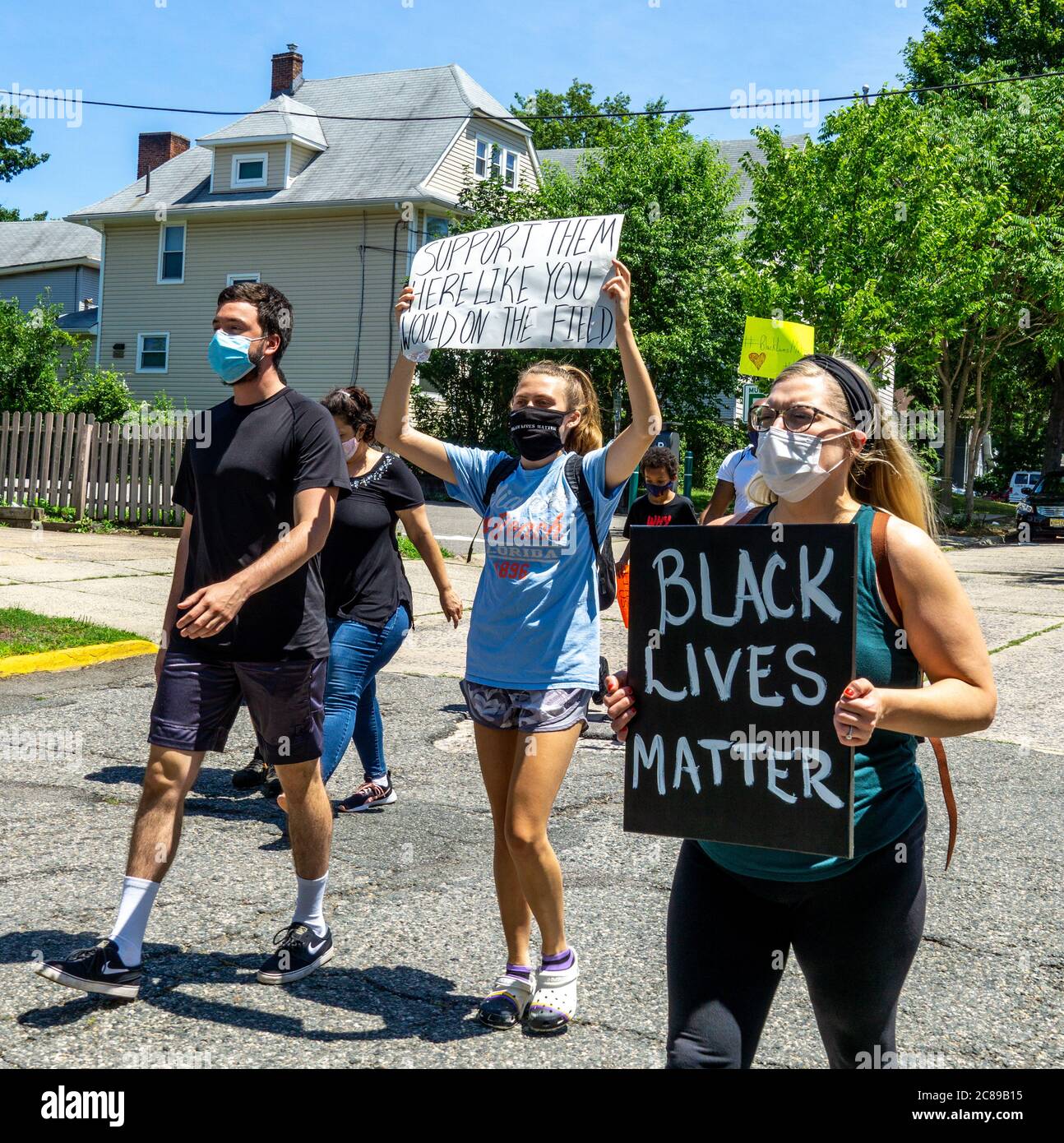 Black Lives Matter Protest - People marching in street holding BLM ...