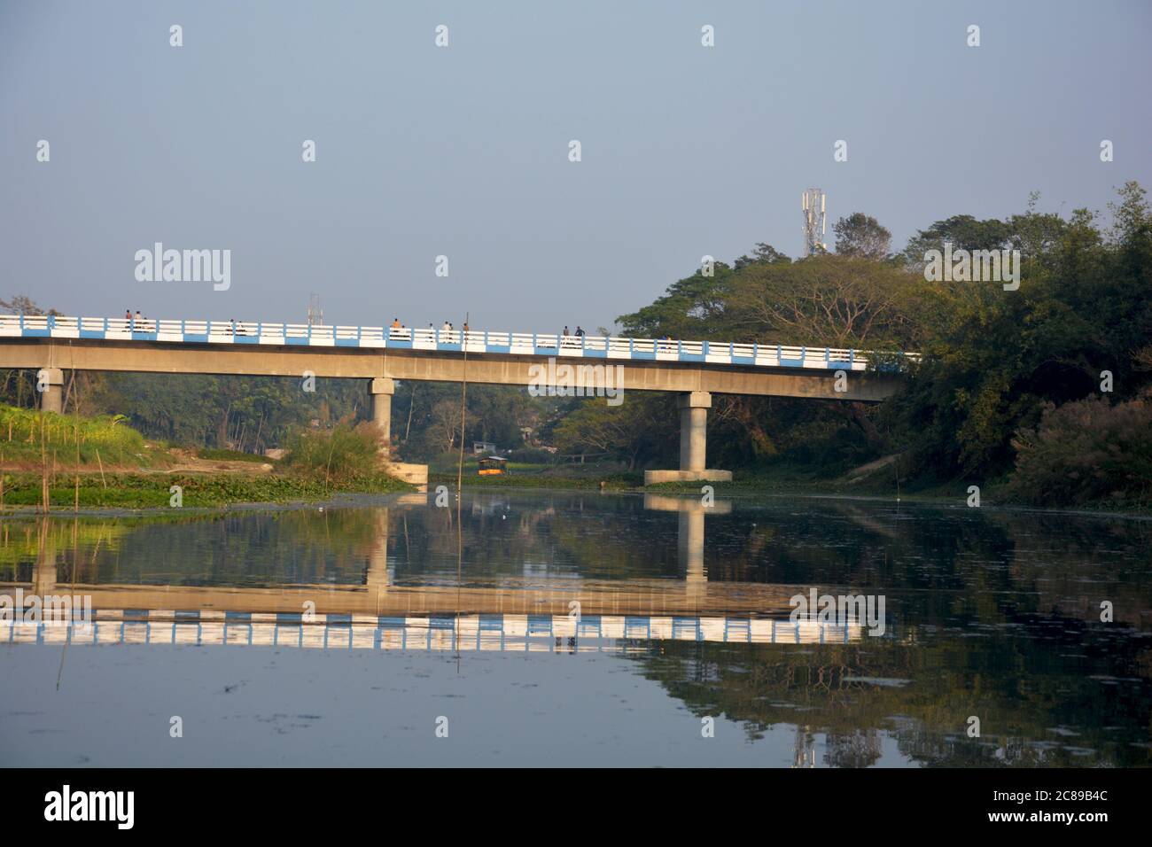 Concrete road bridge on pillars in an Indian village, selective ...