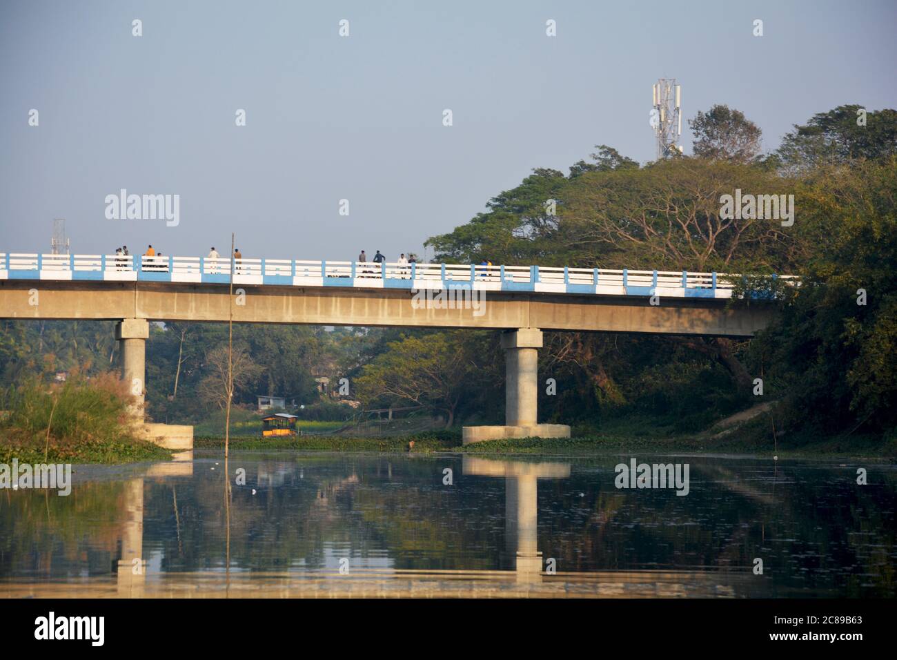 Concrete road bridge on pillars in an Indian village, selective ...