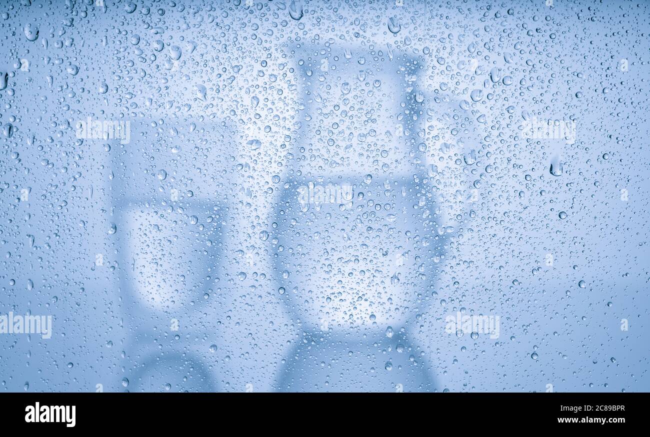 Pitcher with drinking water and a glass with a drink behind a glass ...