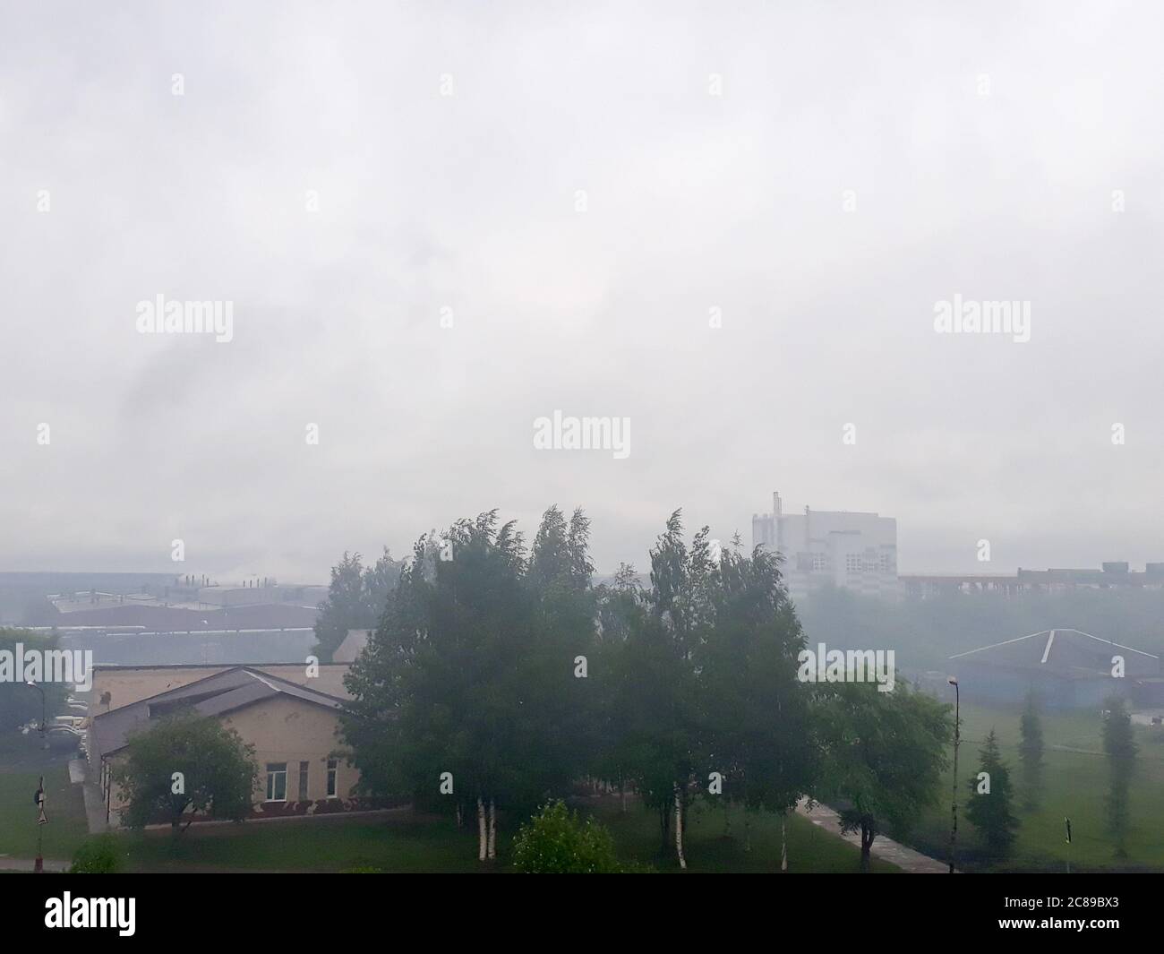 Fog over the industrial zone. Summer industrial landscape with fog in ...